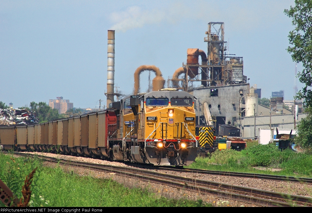 UP 6917, GE C4460AC, re-engined and re-numbered working eastbound with coal loads passing the ...